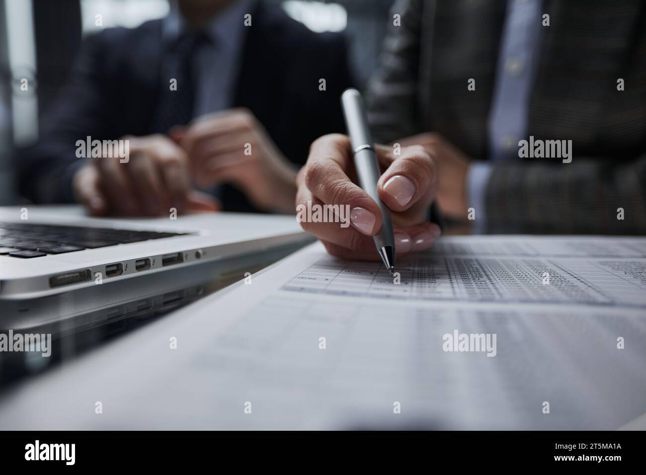 man looking through to documents. Business assessment and audit Stock ...