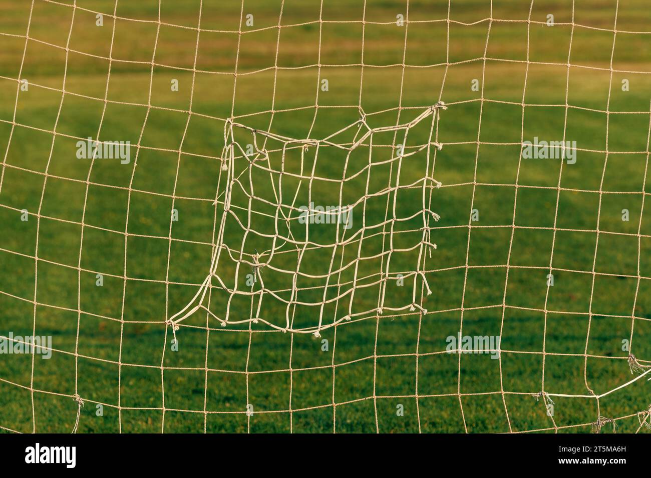 Old patched soccer goal net as abstract sport background and pattern ...