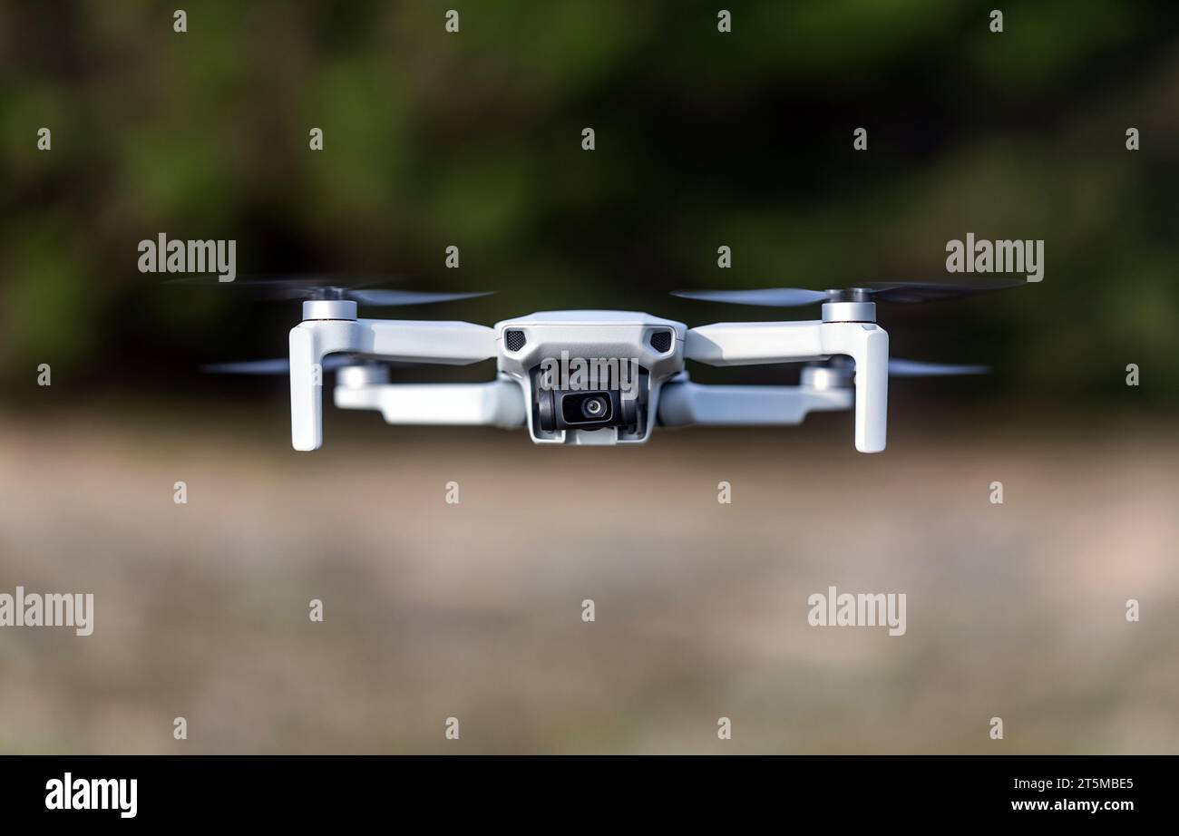Gray drone hover flight in the nature Stock Photo - Alamy