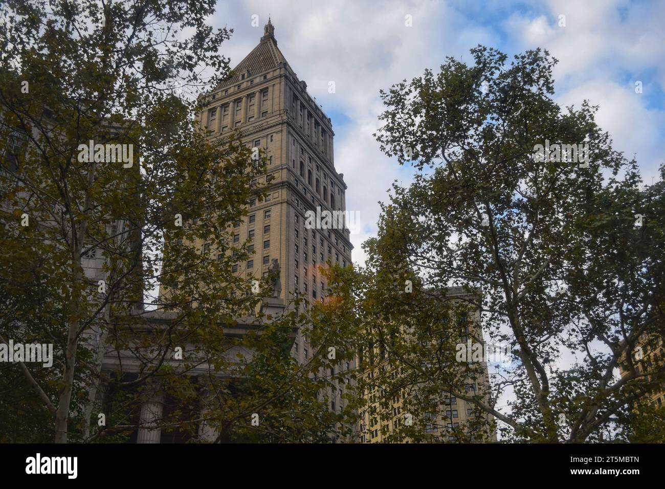 An iconic old clock building stands tall, surrounded by modern ...