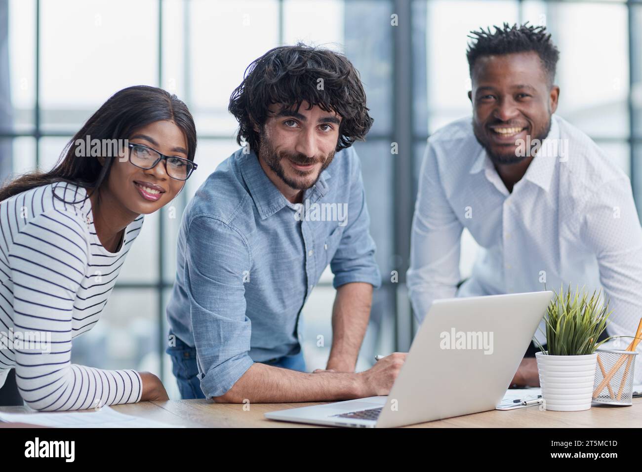 Business professionals in a meeting, collaborating, communicating, and ...