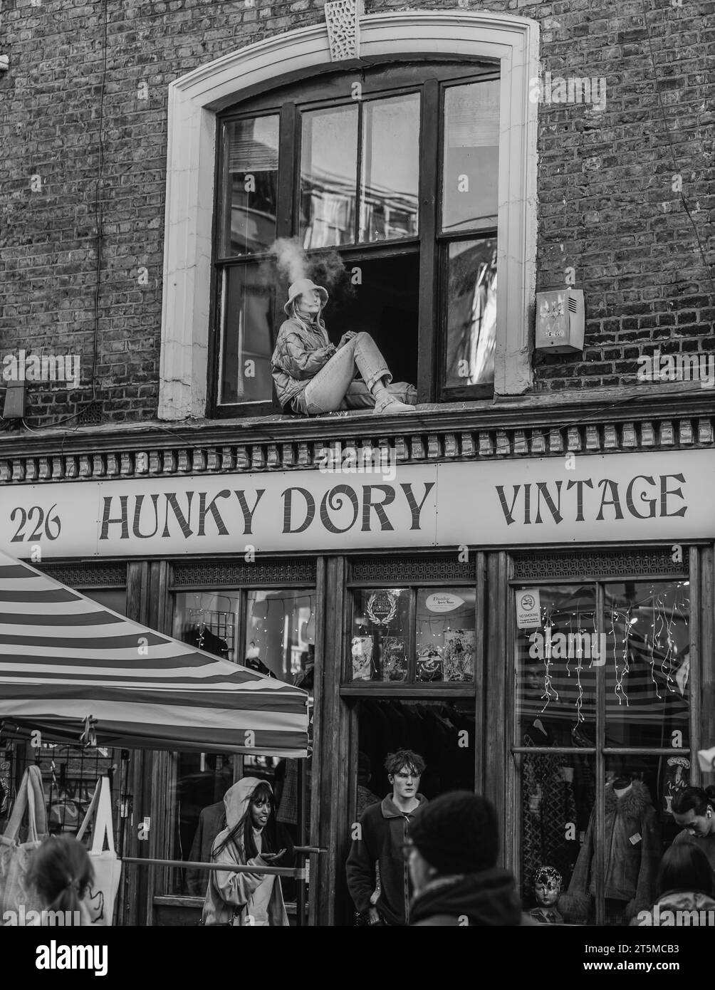 Smoking and enjoying the view overlooking the famous Brick Lane in the ...