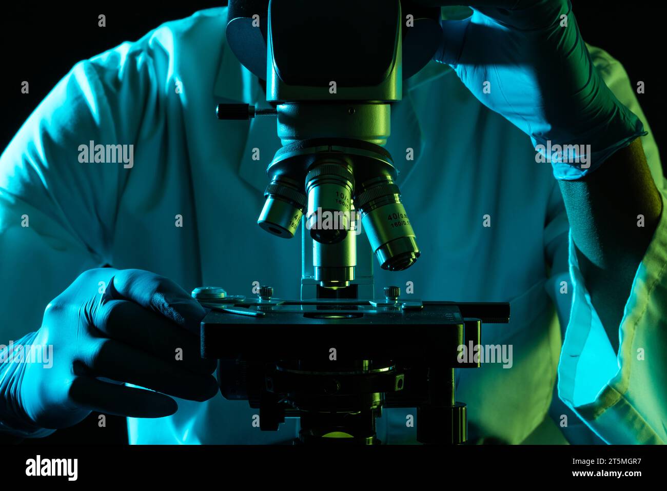 Scientist using microscope and copy space on black background Stock ...