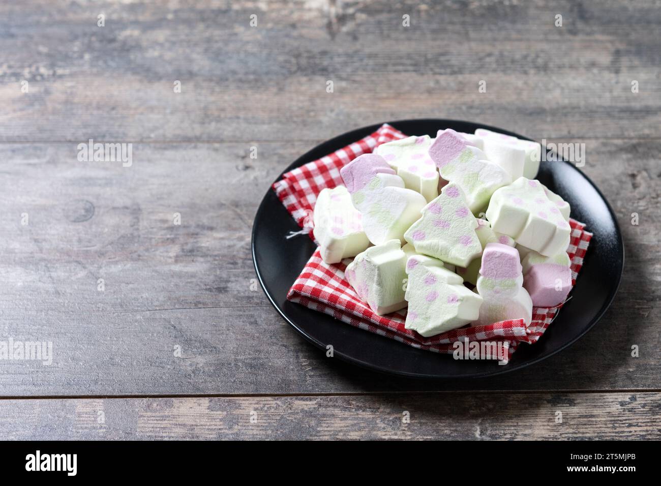 Christmas marshmallow with Christmas tree and snowman shape on wooden ...