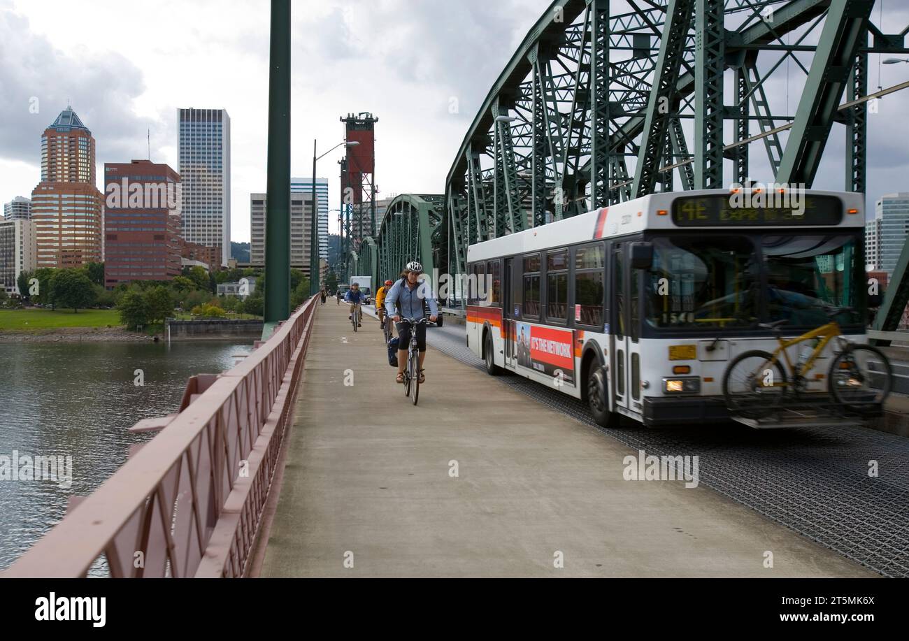 Bicycle commuters head across a bridge in Portland, Oregon Stock Photo ...