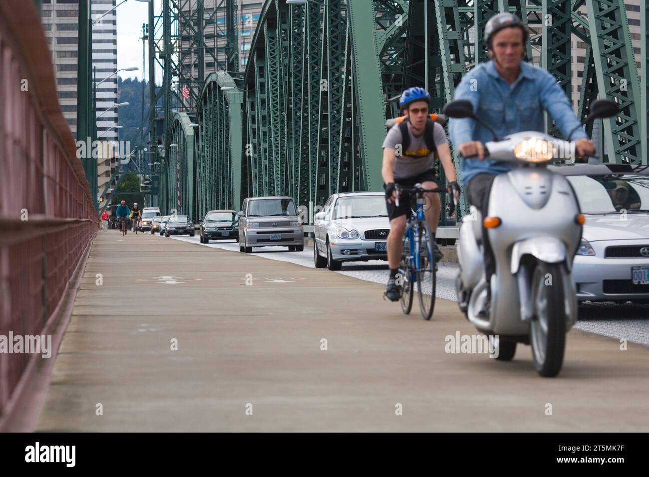 Bicycle commuters head across a bridge in Portland, Oregon Stock Photo ...