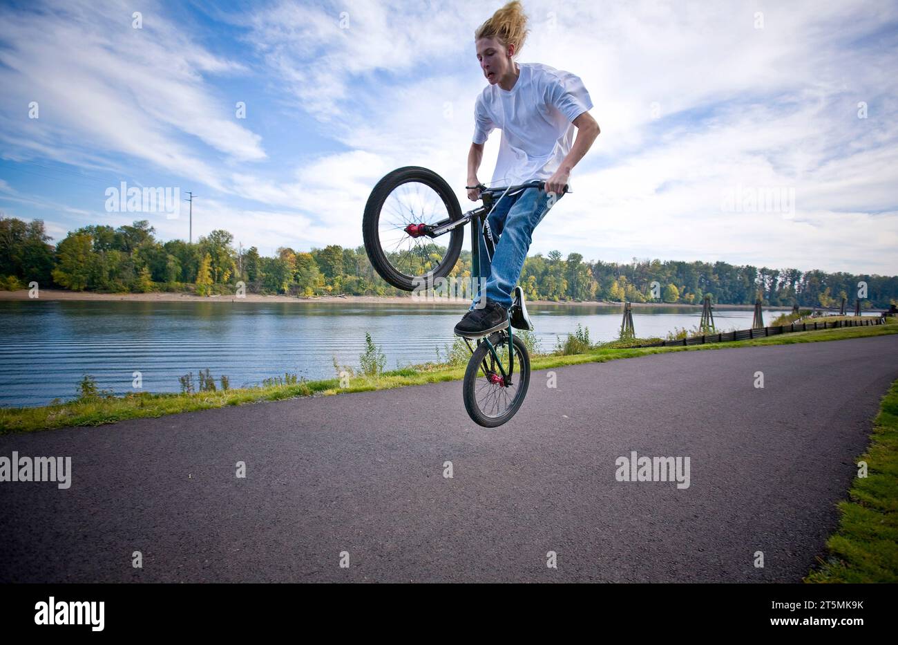 Teenager does a wheelie, Portland, Oregon Stock Photo - Alamy