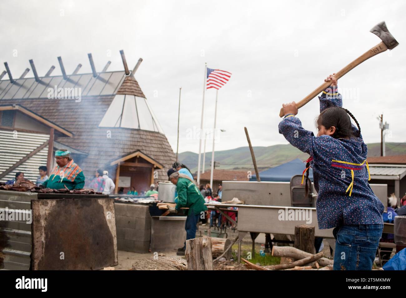 An Indian boy chops wood for the barbecue. Celilo, Oregon Stock Photo ...
