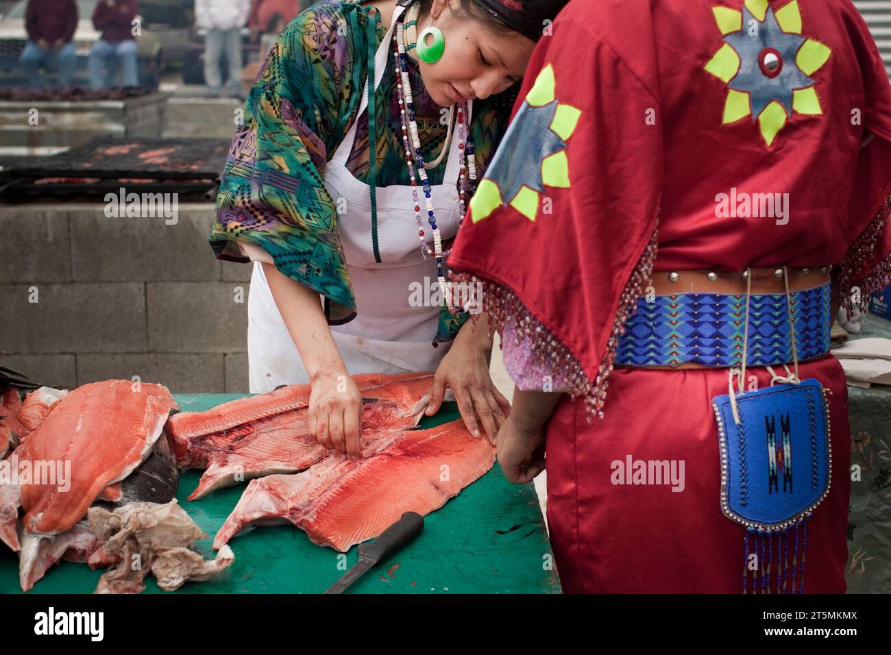 Salmon being cleaned and cooked for the annual First Salmon Feast ...