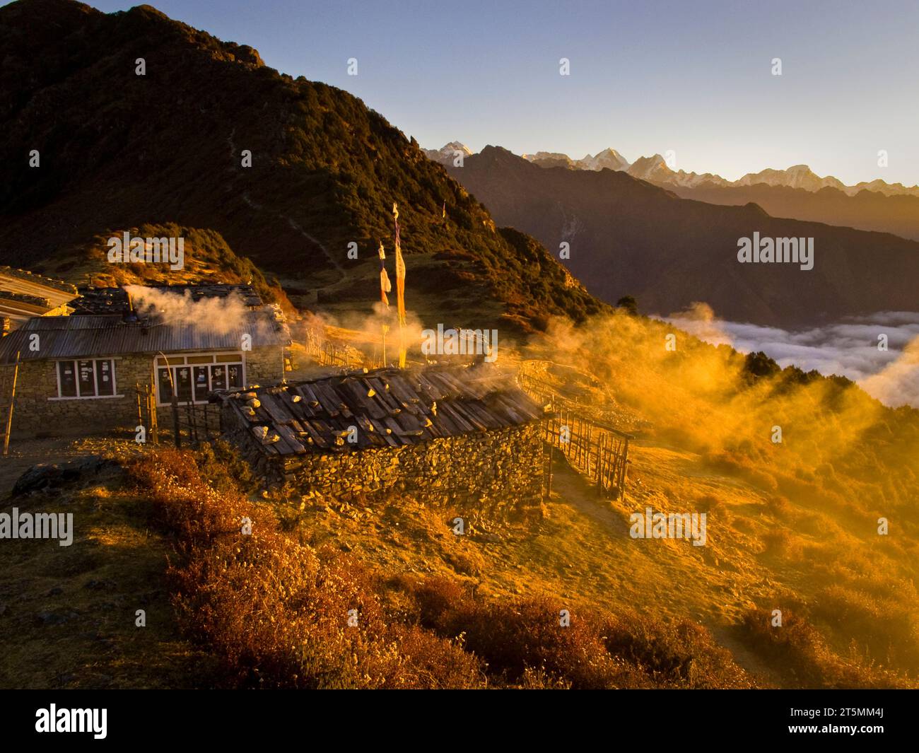 A lodge at sunset above the clouds on the Helambu circuit trek in Nepal ...