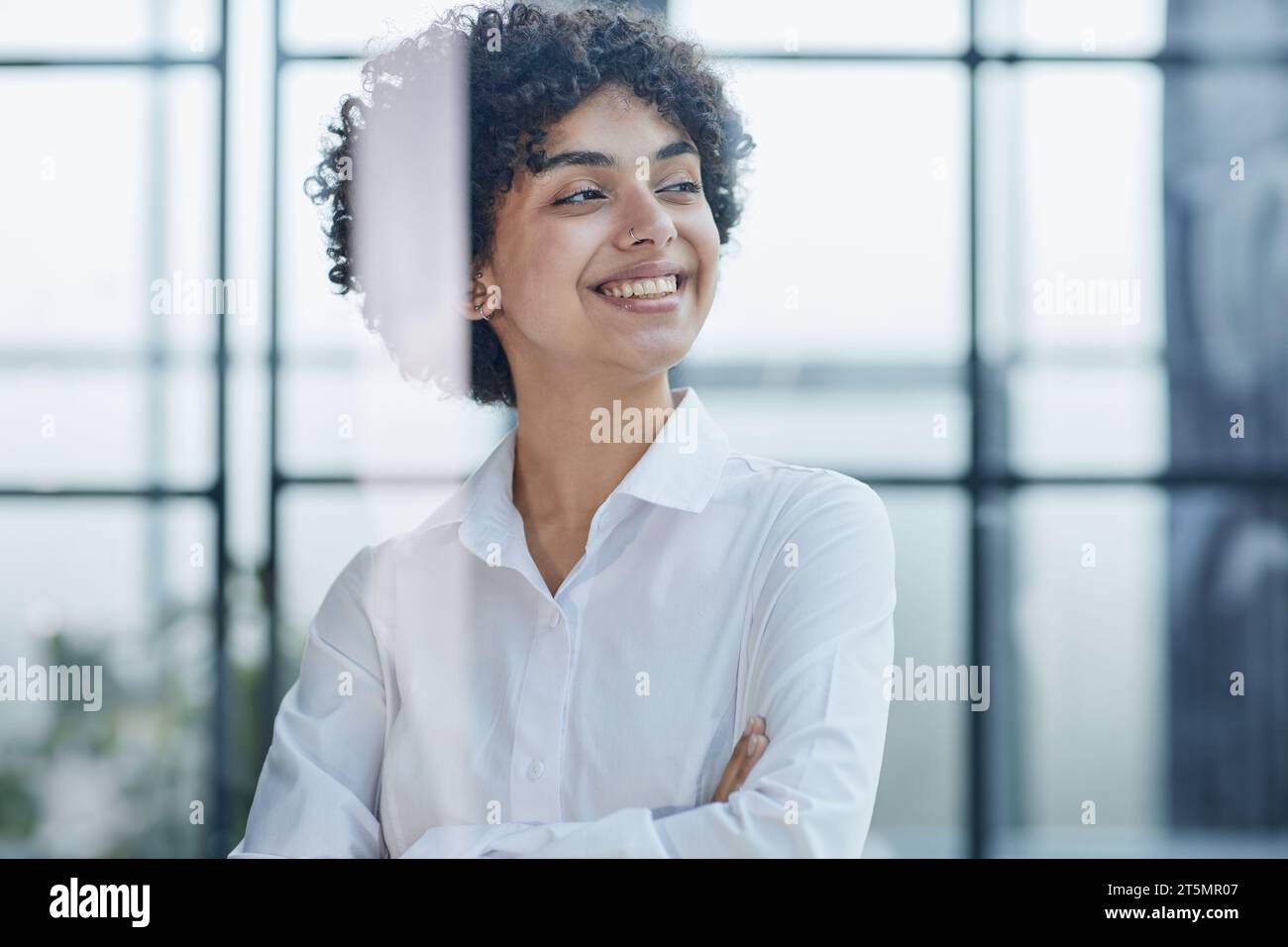 business woman looks admiringly into the distance through the glass ...
