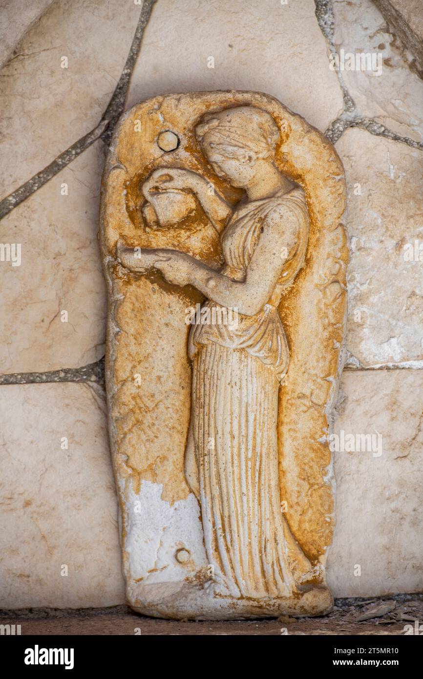 stone plaque or panel depicting carving of classical greek woman ...