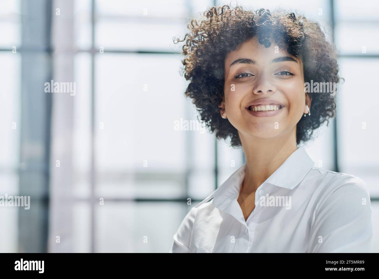 business woman looks admiringly into the distance through the glass ...