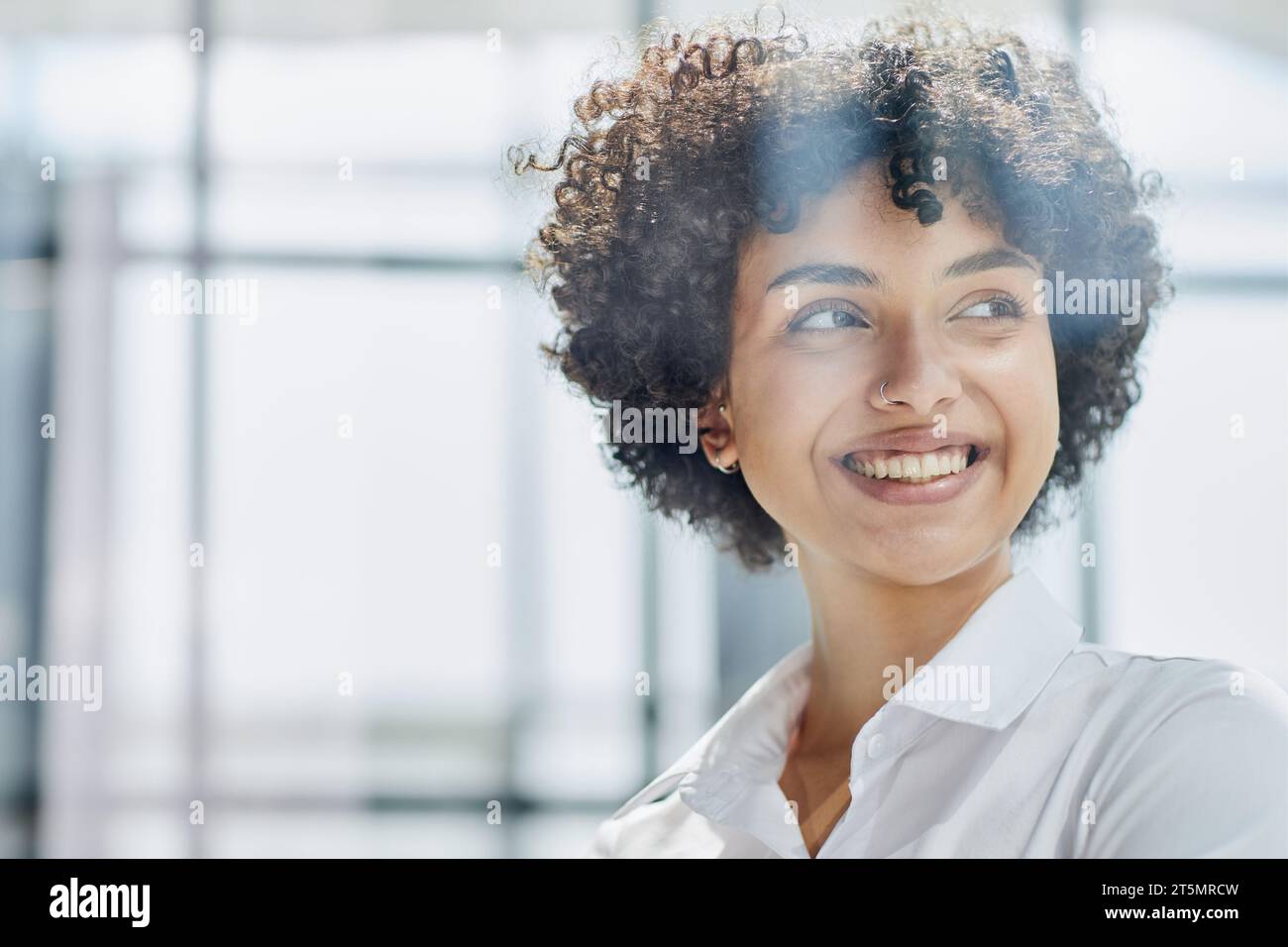 business woman looks admiringly into the distance through the glass ...