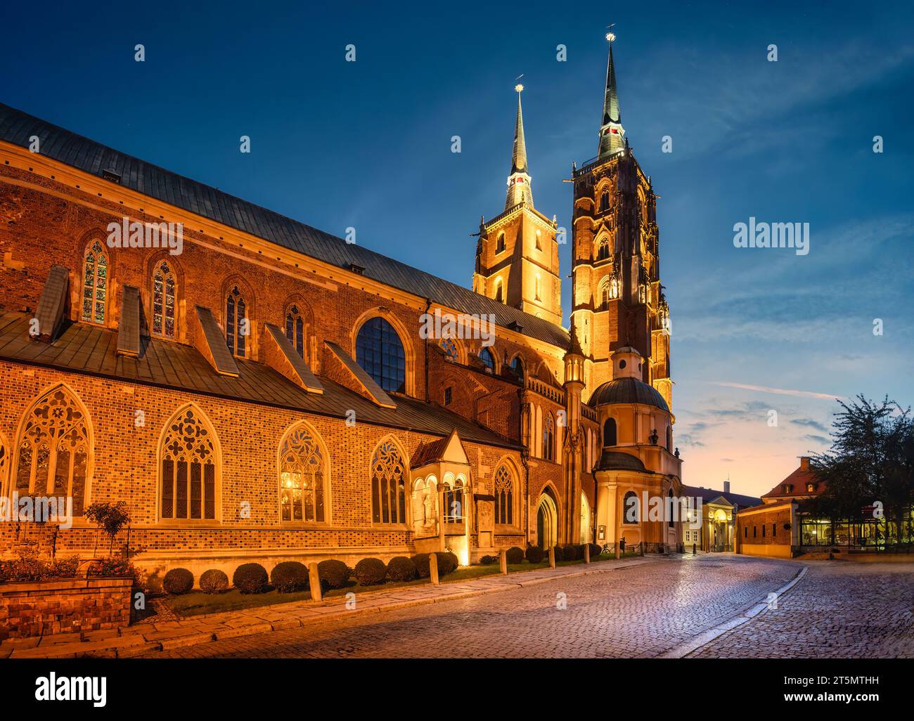Wroclaw cathedral of St. John the Baptist facade illuminated at late ...