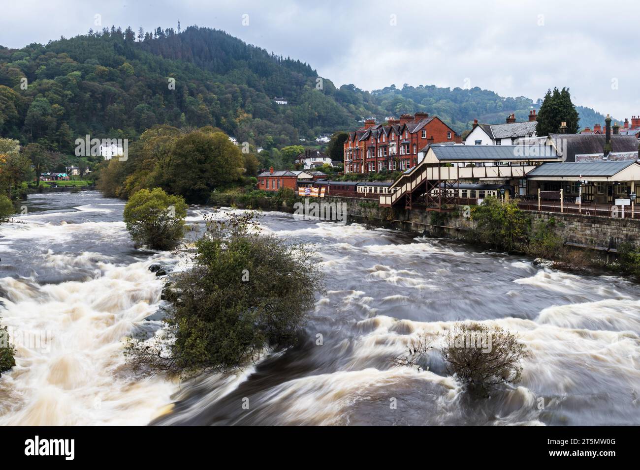 White water on the River Dee as it rushes through the Welsh town of ...