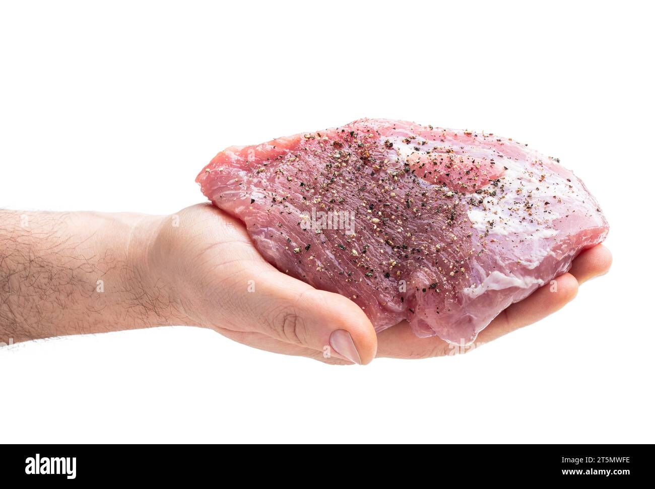 Hand holding spiced pork meat slice isolated on white background Stock ...
