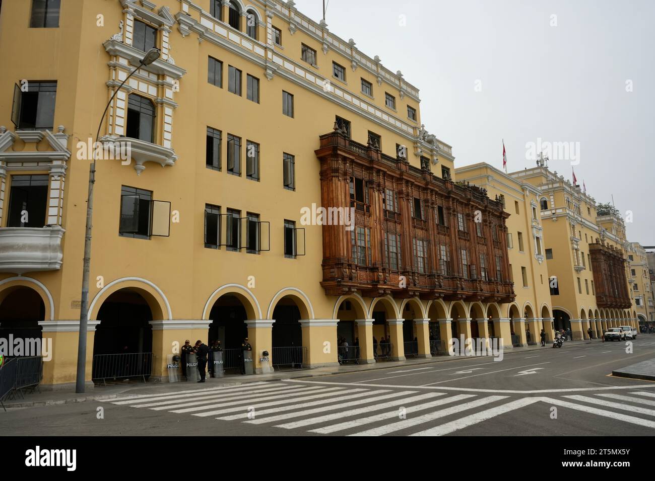 Yellow Buildings with traditional Peruvian Wooden carved window balcony ...