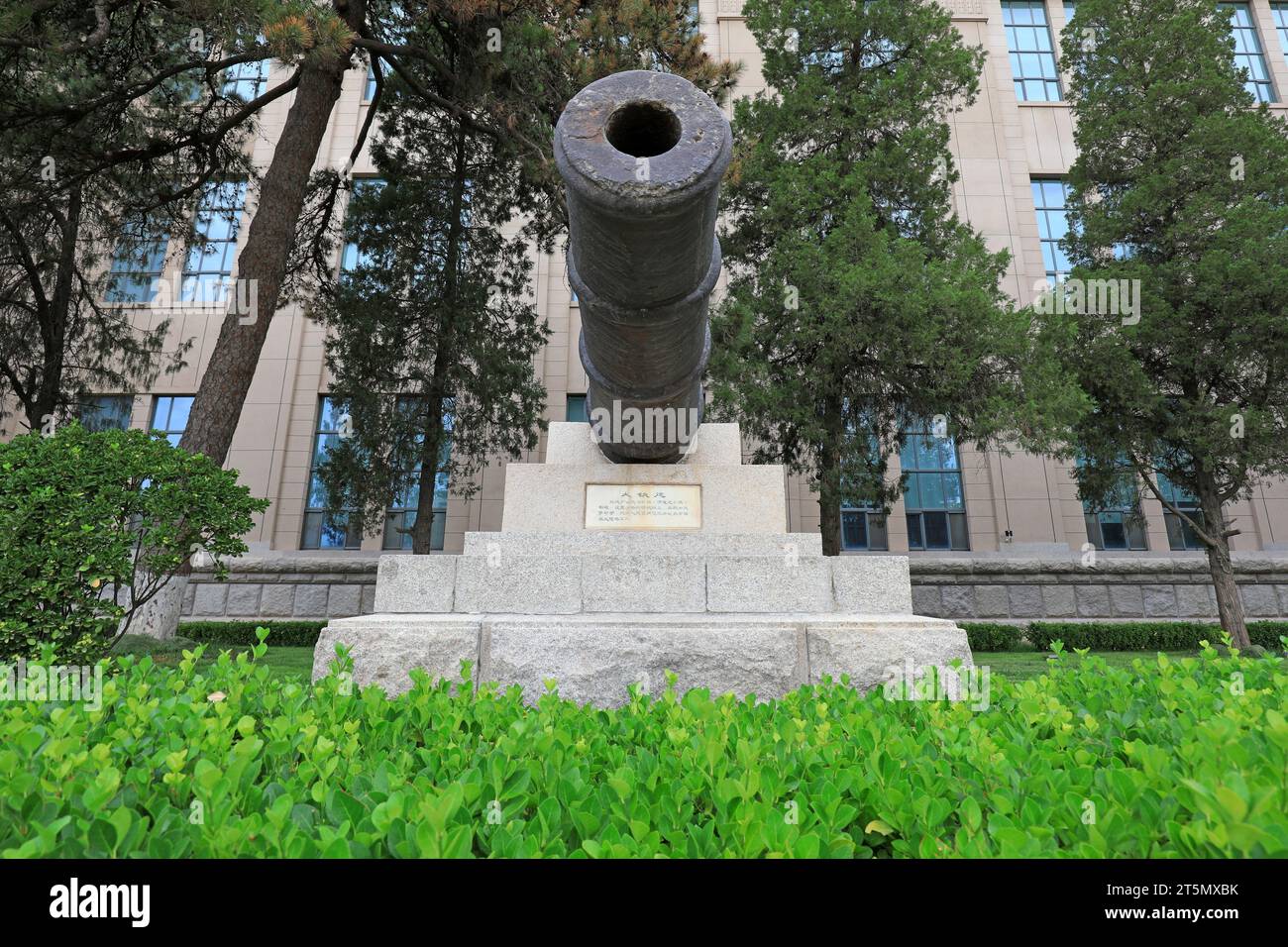 Beijing - June 28, 2019: The iron gun was mounted on a rock base ...