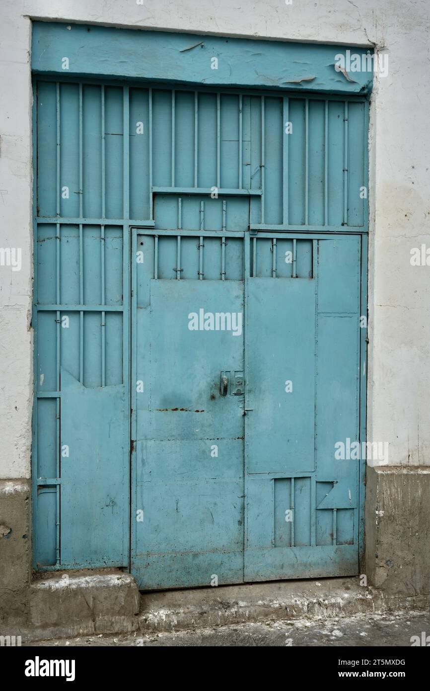 Rustic Blue metal door and agte on a concrete wall, Lima, Peru Stock ...