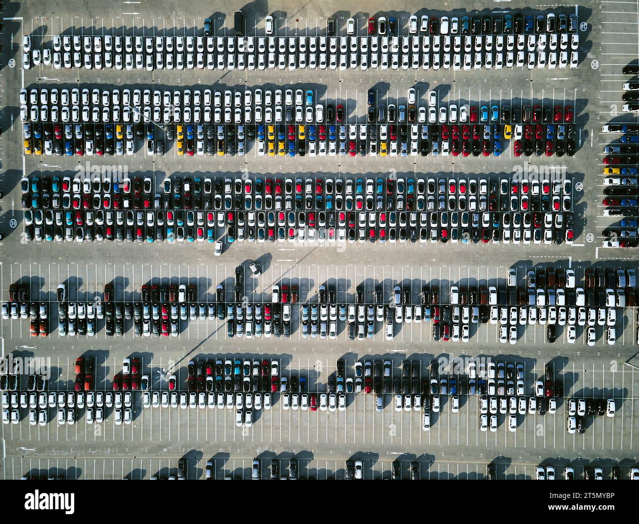 Aerial view of a massive parking lot at a car manufacturing facility ...