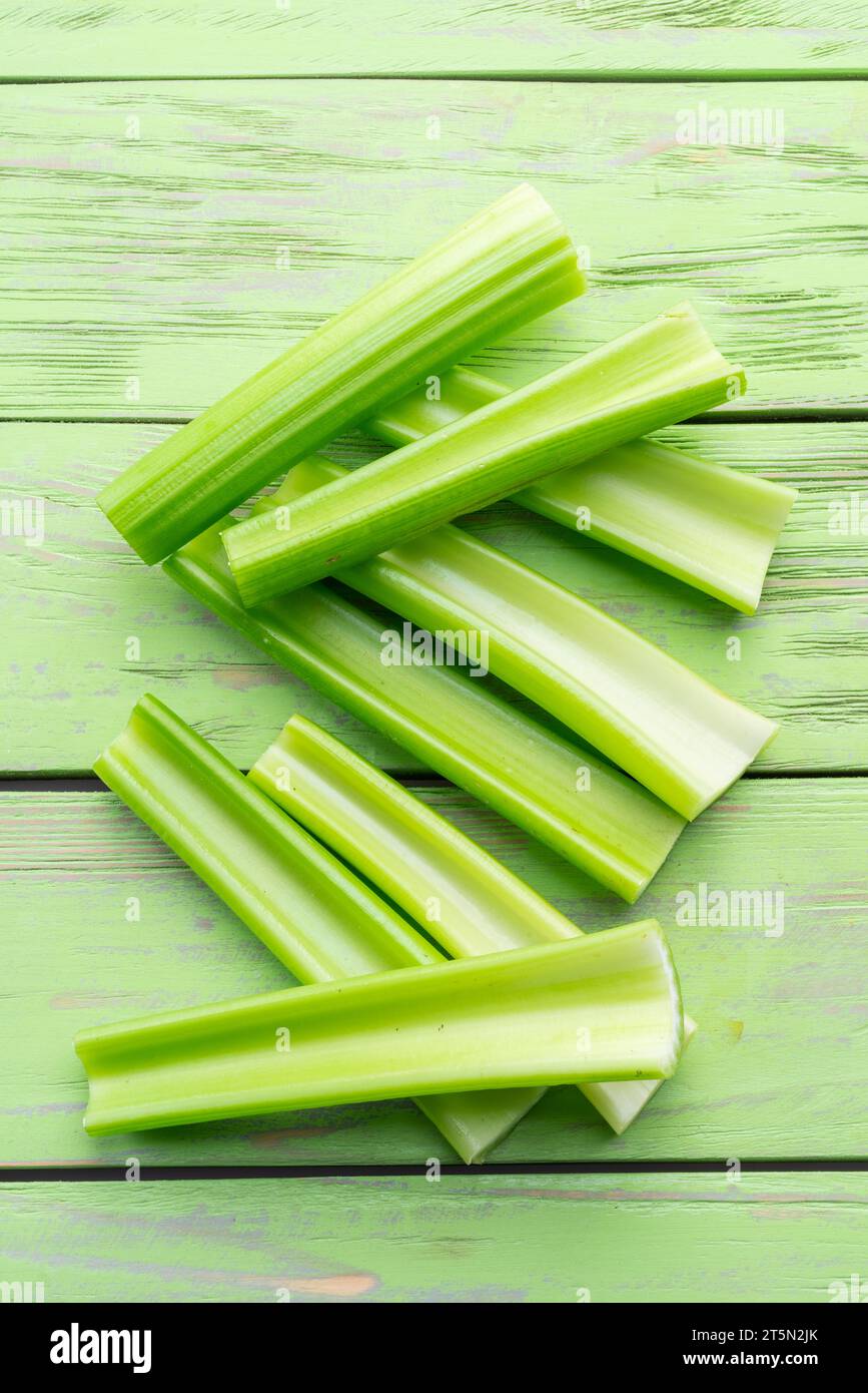 Pile of celery ribs isolated on white background Stock Photo - Alamy