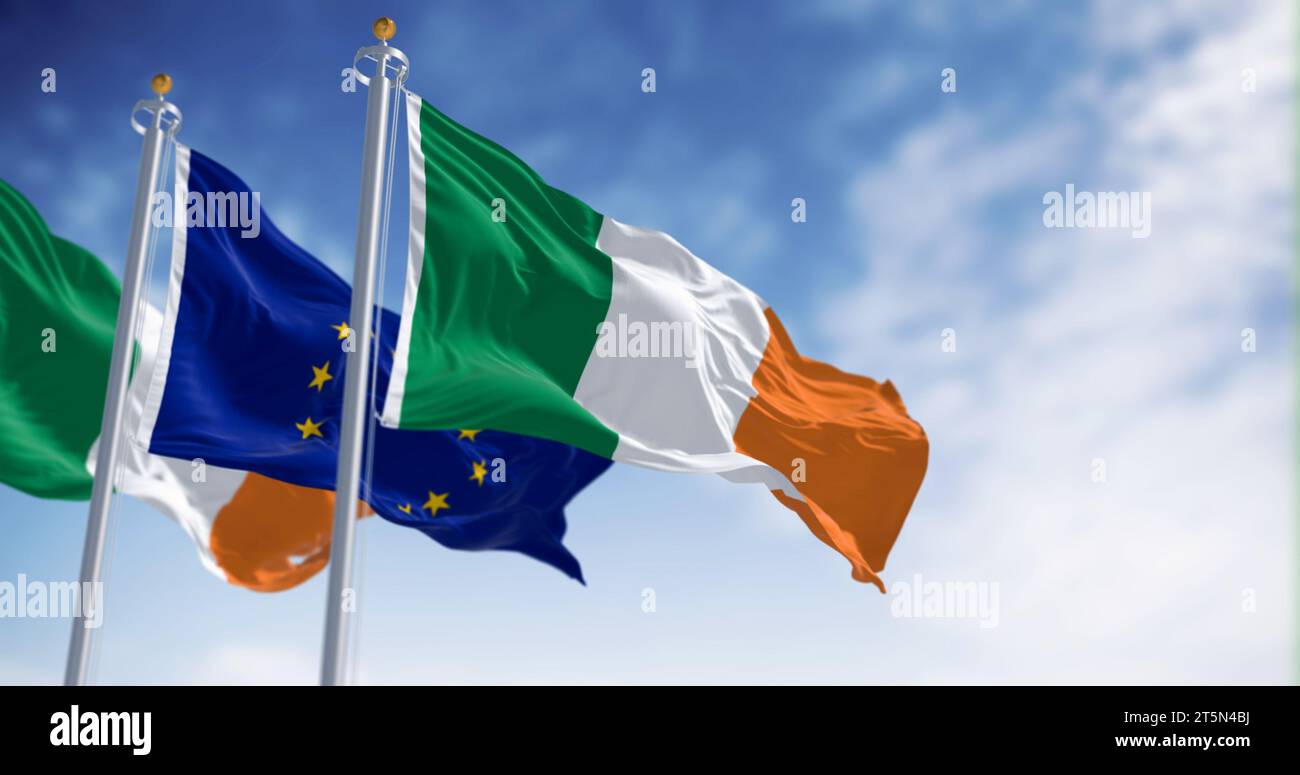 Flags of Ireland and the European Union waving on a clear day. Ireland ...
