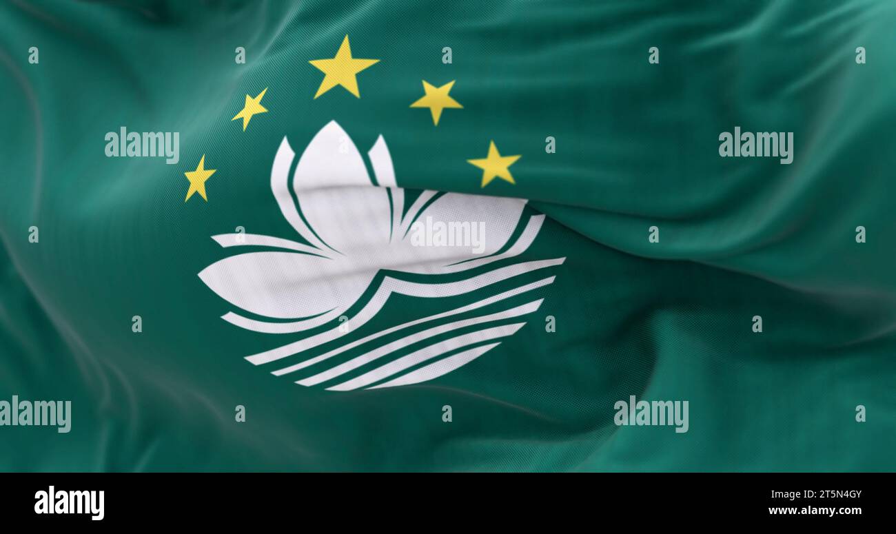 Close-up of Macau flag waving. Green area, lotus flower center, 5 stars ...