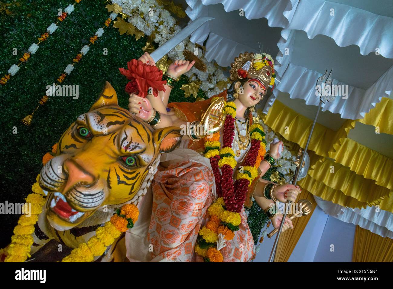 A beautiful idol of Maa Durga being worshipped at a pandal during ...