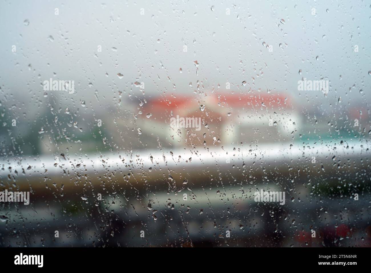 Rain drops on the window in the city, see a shadow of a school Stock ...