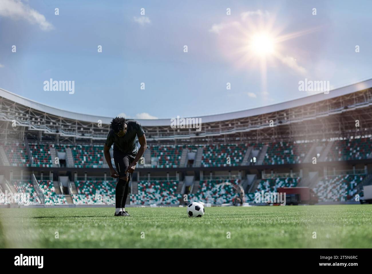 Professional male football, soccer player on stadium background Stock ...