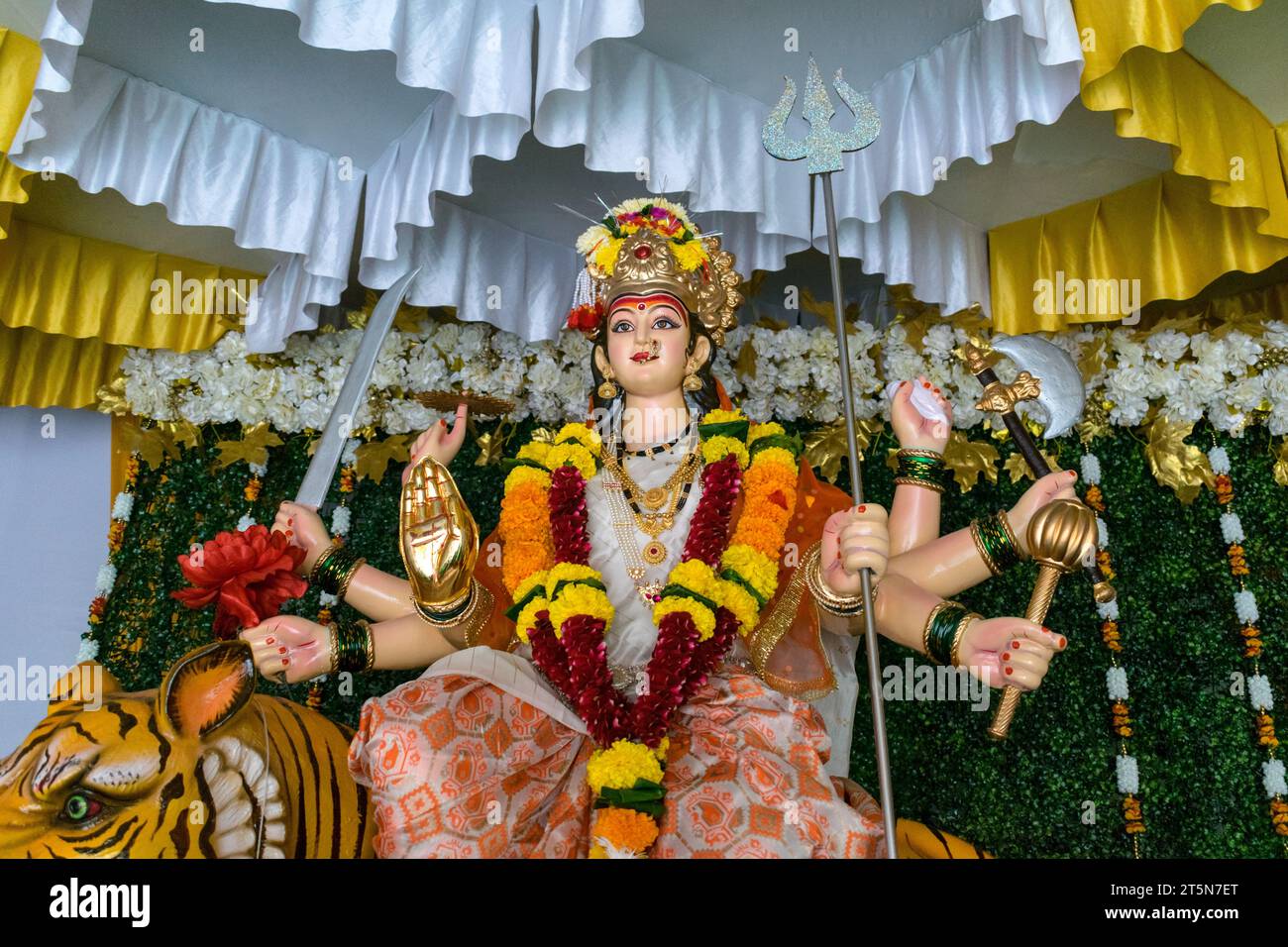 A beautiful idol of Maa Durga being worshipped at a pandal during ...