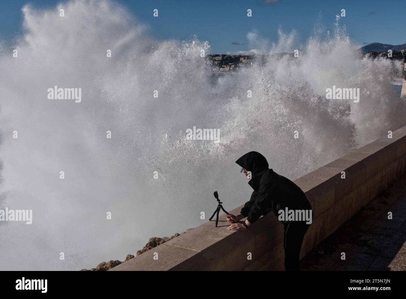 Nice, France. 5th Nov, 2023. A resident takes photos of huge waves ...