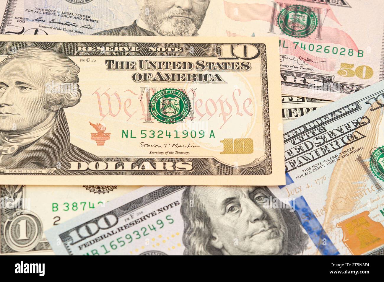 Bank notes of one, ten, fifty and 100 US dollars in top view isolated ...