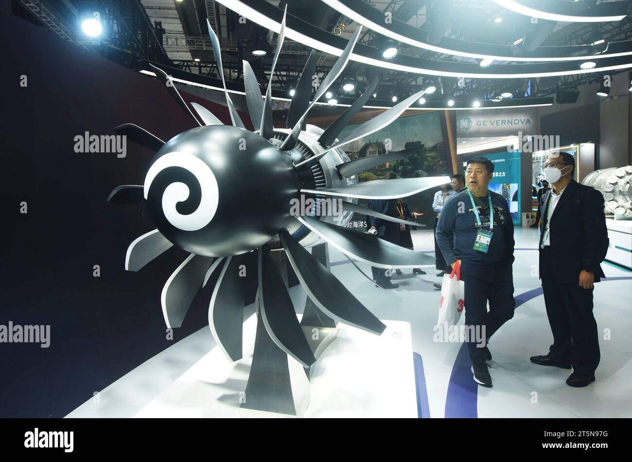 Visitors stop by a model showing the RISE technology exhibited by GE ...