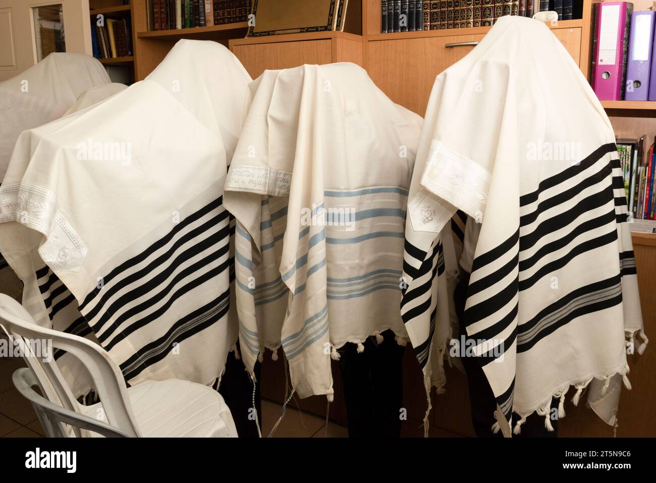 Cohanim or Jewish priests cover their heads with their prayer shawls ...