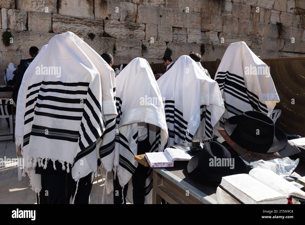 Cohanim or Jewish priests cover their heads with their prayer shawls ...