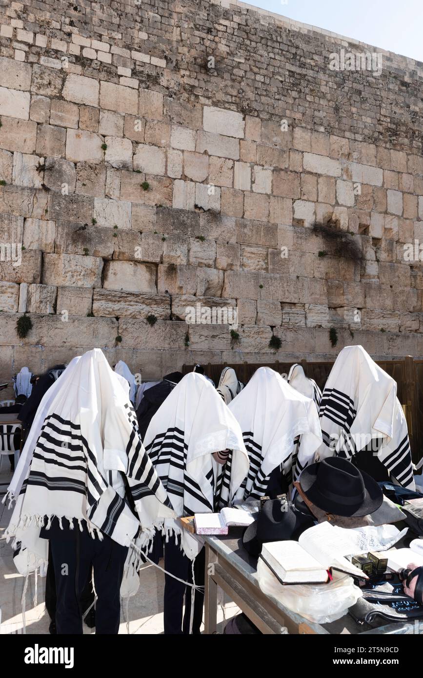 Cohanim or Jewish priests cover their heads with their prayer shawls ...