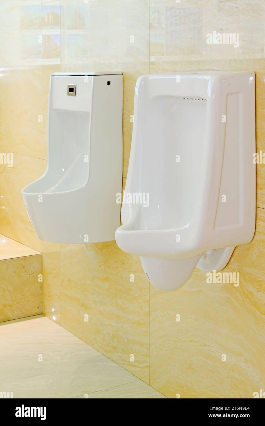 Ceramic urinal on the wall, closeup of photo Stock Photo - Alamy