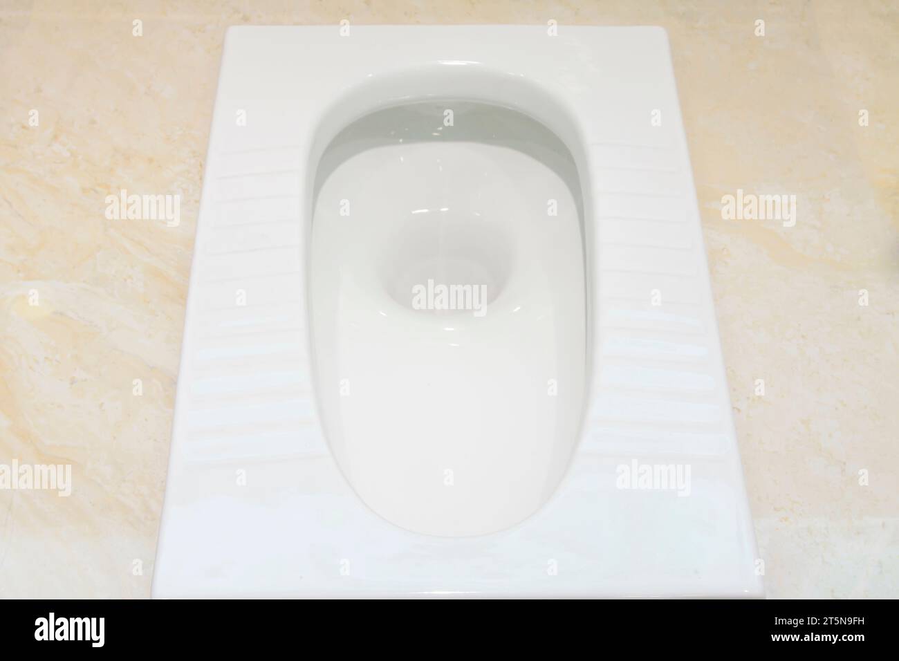 Ceramic squat toilets, closeup of photo Stock Photo - Alamy
