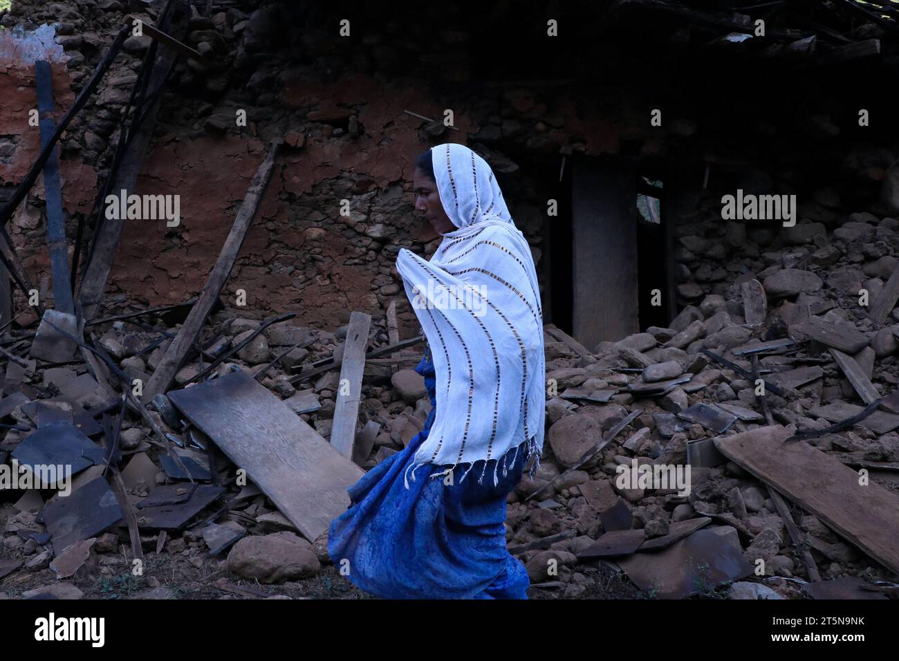 On November 5, 2023, in Jajarkot, Nepal. A woman walk across her ...