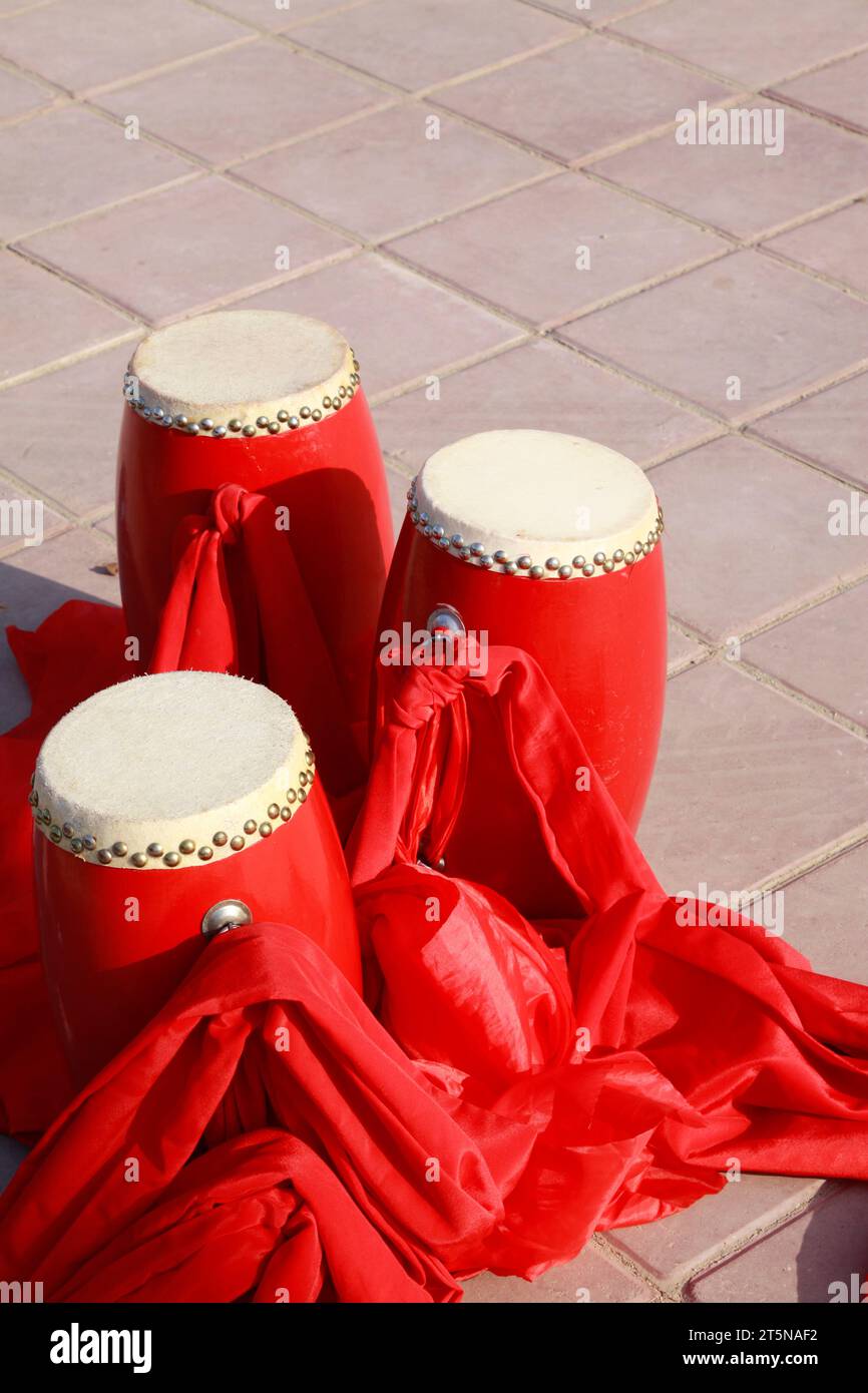 Red waist drum on the ground, closeup of photo Stock Photo - Alamy