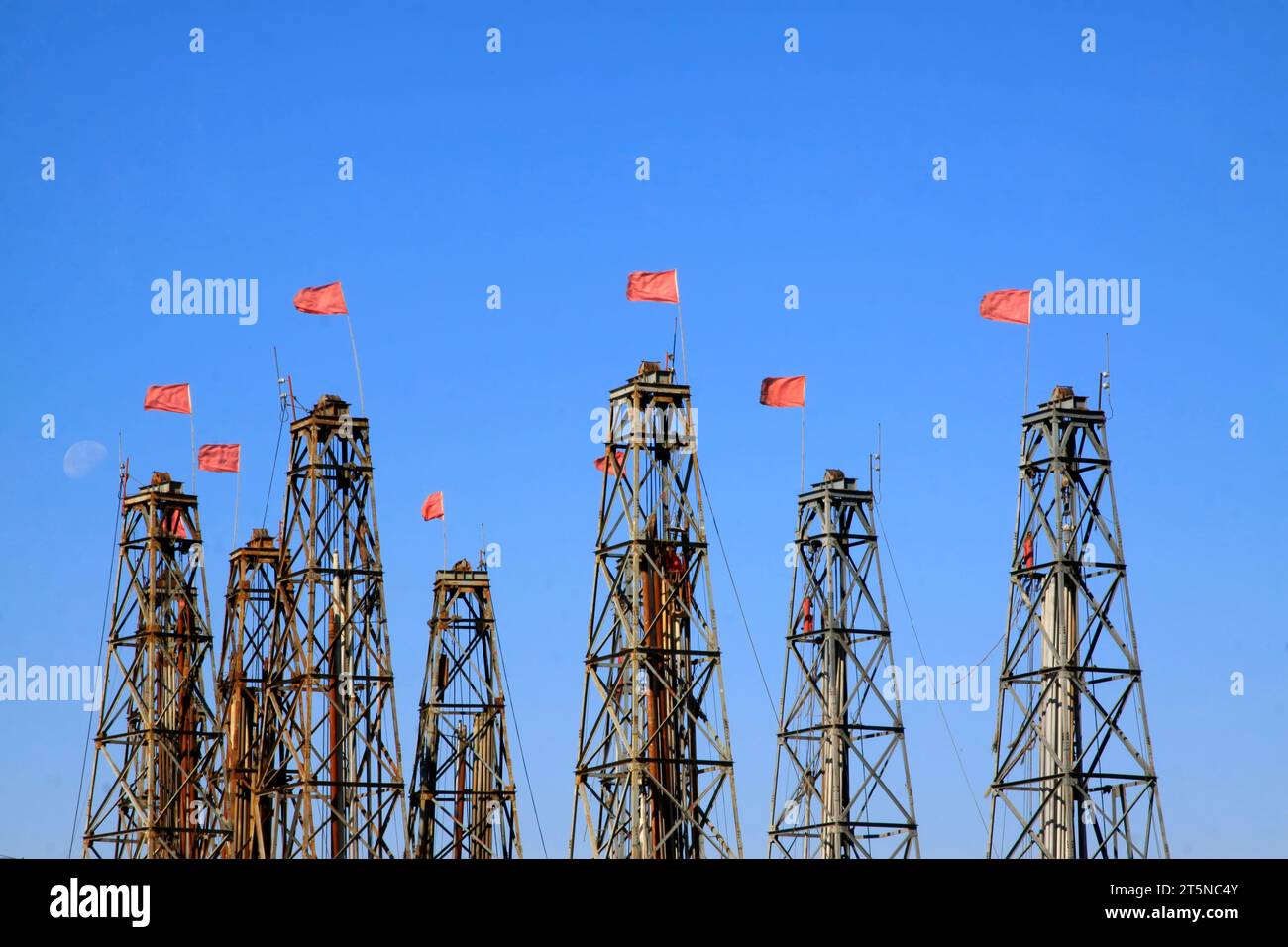 Drilling rig derrick under blue sky, closeup of photo Stock Photo - Alamy