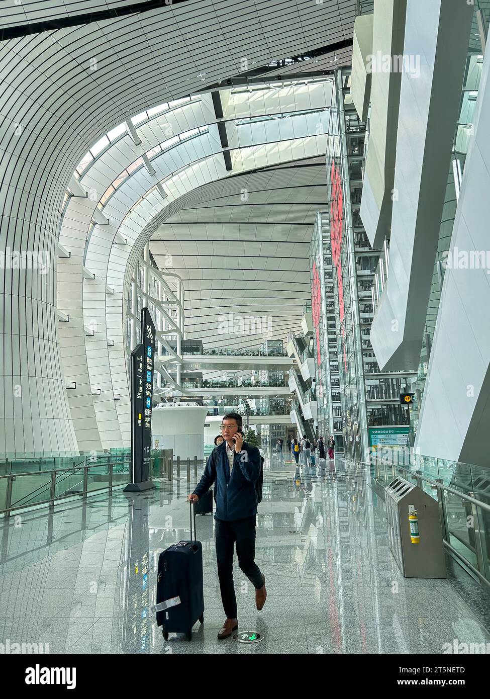 Beijing China Man Traveling With Suitcase Talking On Smart Phoneinside Views Of Beijing