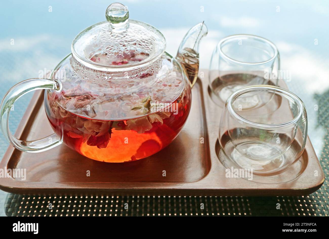 Closeup of a pot of rose infusion tea with a pair of tea cups Stock ...