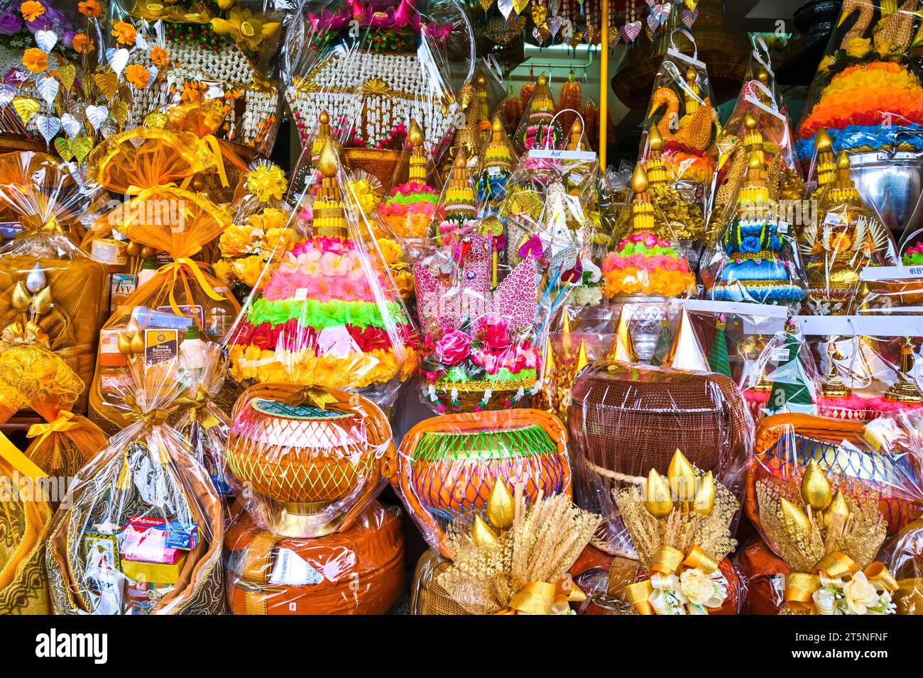 A large selection of rich, fancy offering baskets with flowers ...