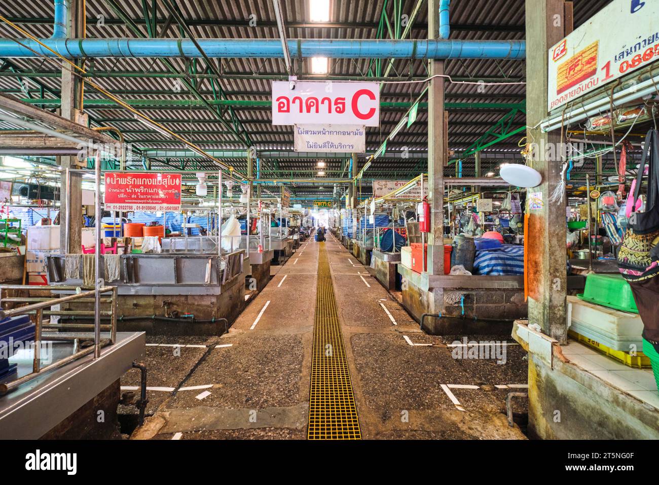 Quiet aisles, and stalls, all washed and cleaned up during a closed day ...