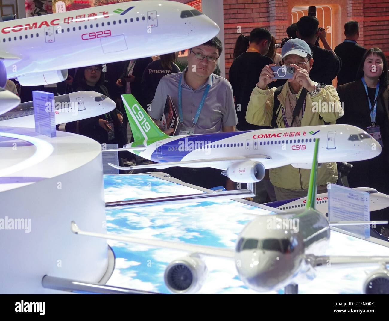 SHANGHAI, CHINA - NOVEMBER 6, 2023 - Visitors look at a model of a ...