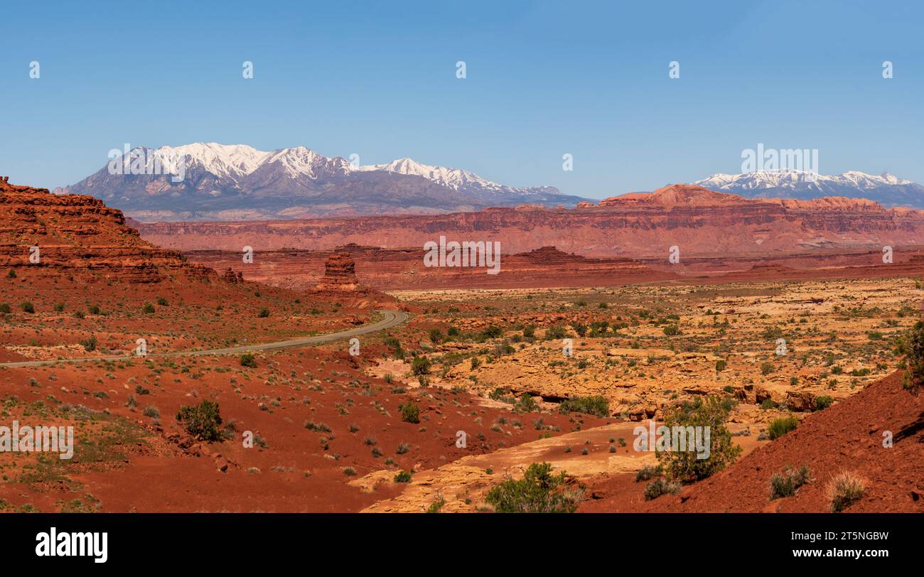 Panoramic view of a desert road in southern Utah, USA with snowy ...