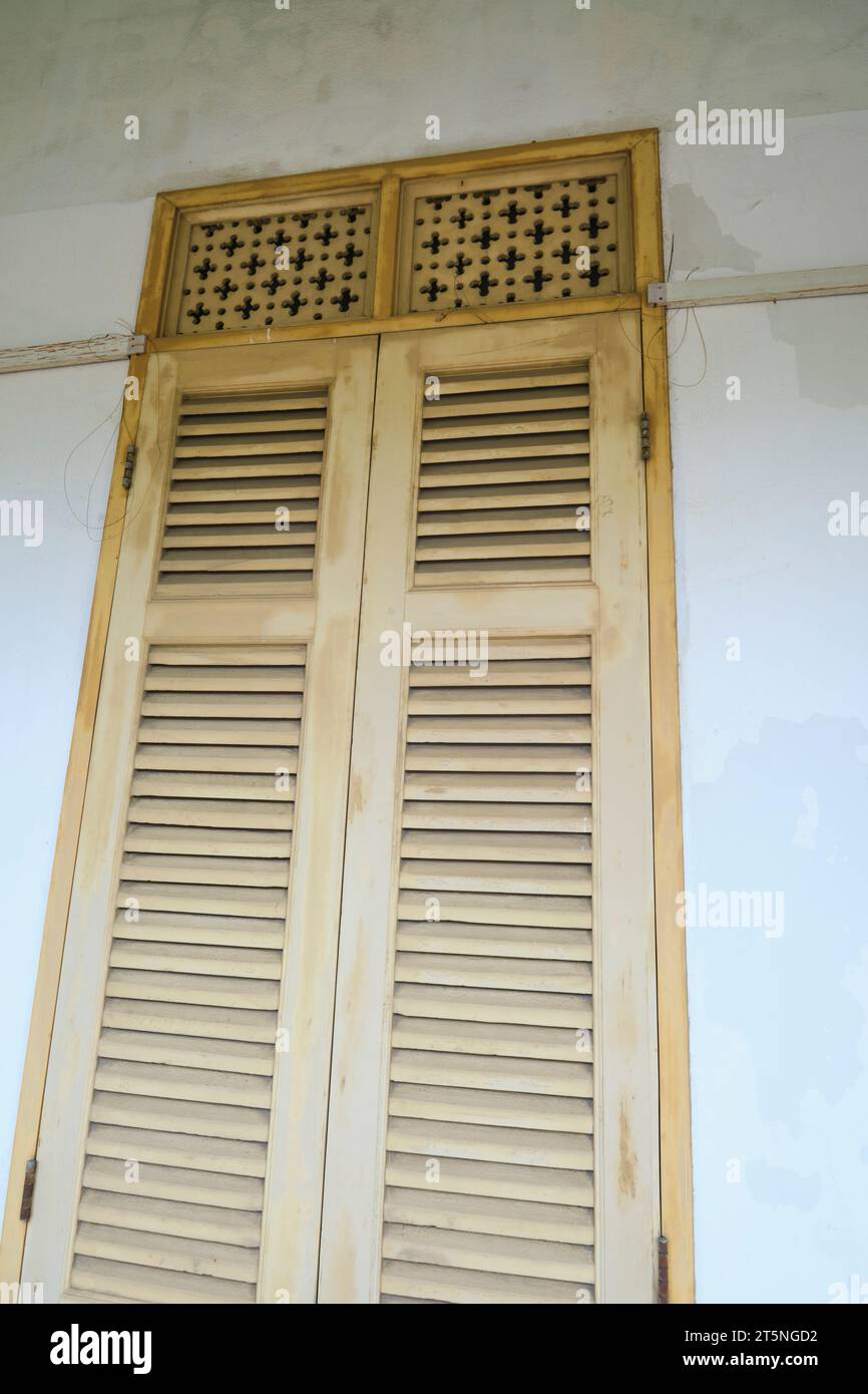 Detail of a set of shutters at the old wood, worn, mix of colonial ...